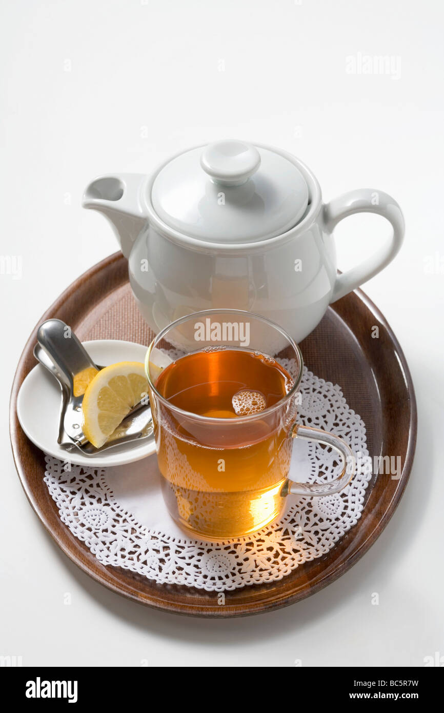 A serving of black tea with lemon Stock Photo - Alamy
