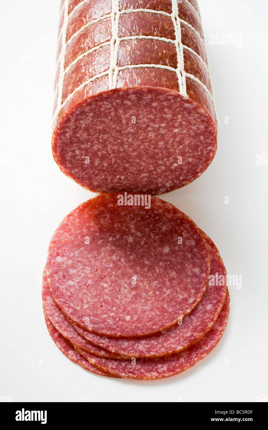 Salami, a piece and slices Stock Photo - Alamy