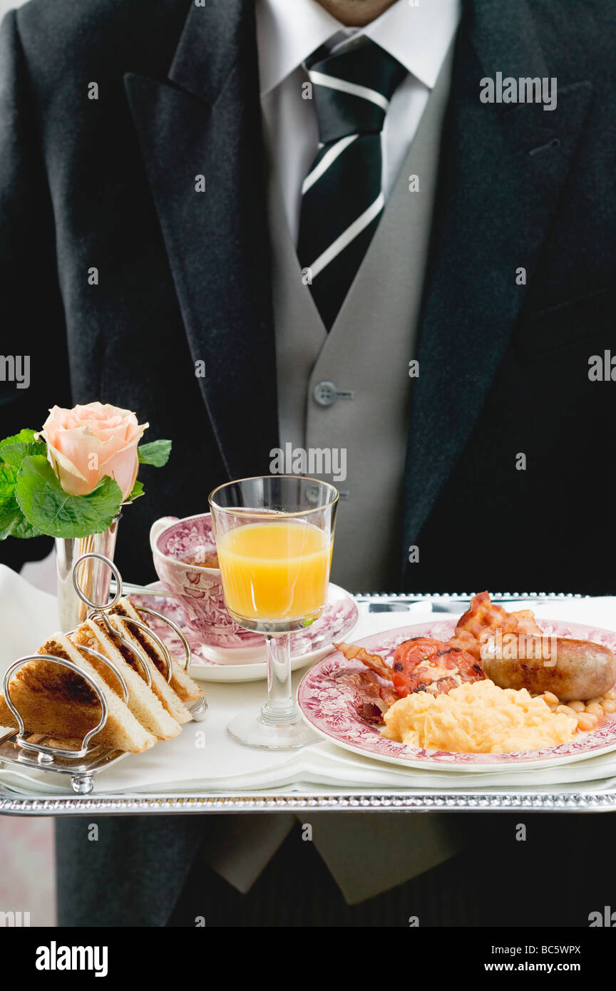 Butler serving tea hi-res stock photography and images - Alamy