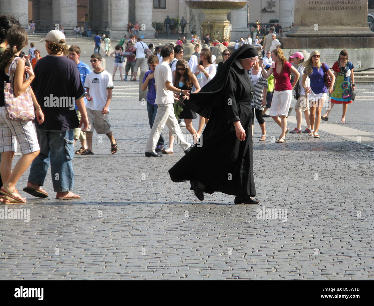 one single nun walking in st peter's square in rome Stock Photo - Alamy
