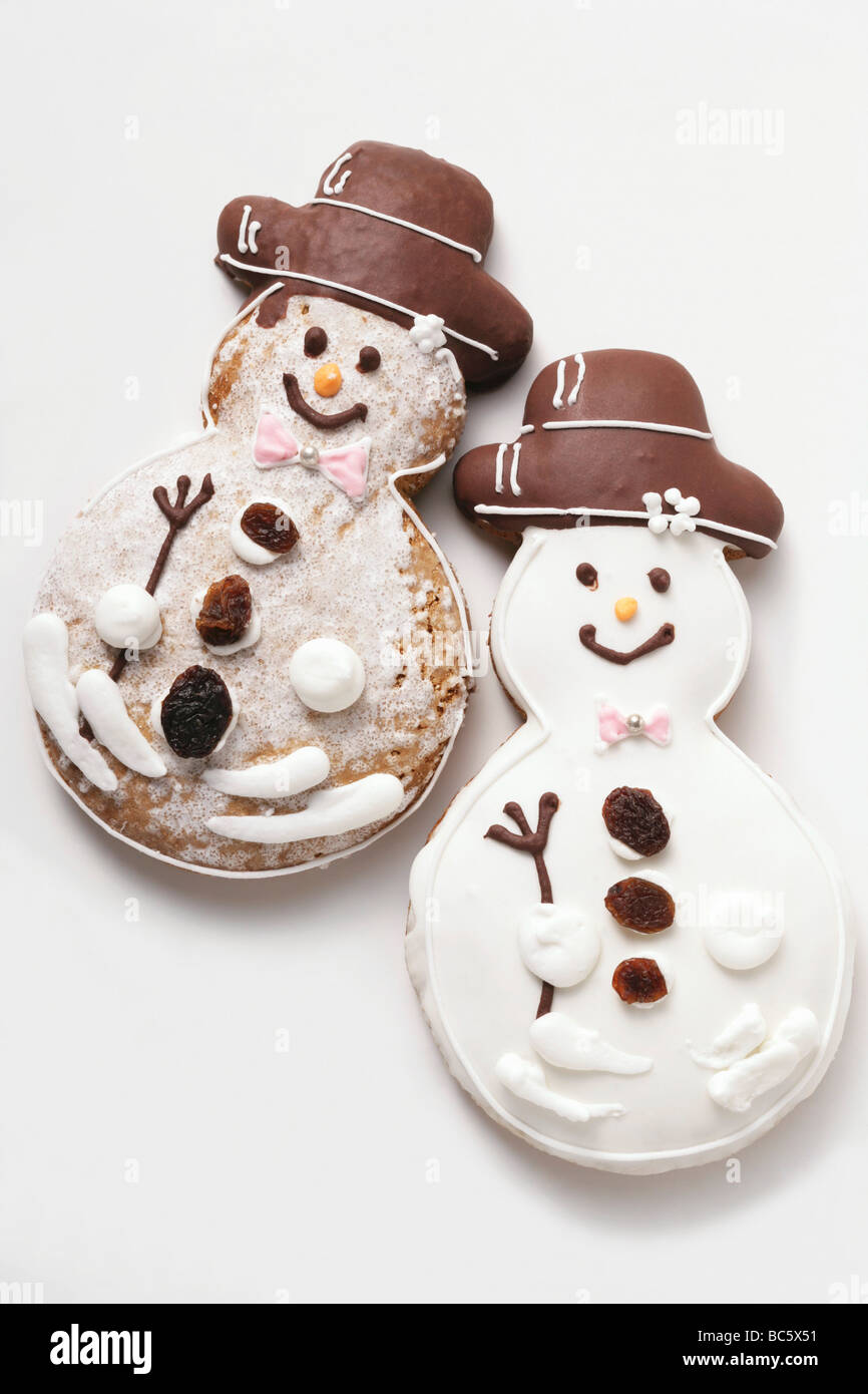 Two gingerbread snowman biscuits Stock Photo - Alamy