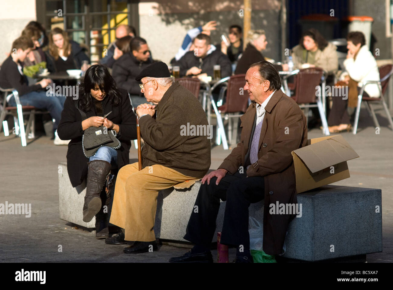 Killing the time in a square at Madrid Stock Photo - Alamy