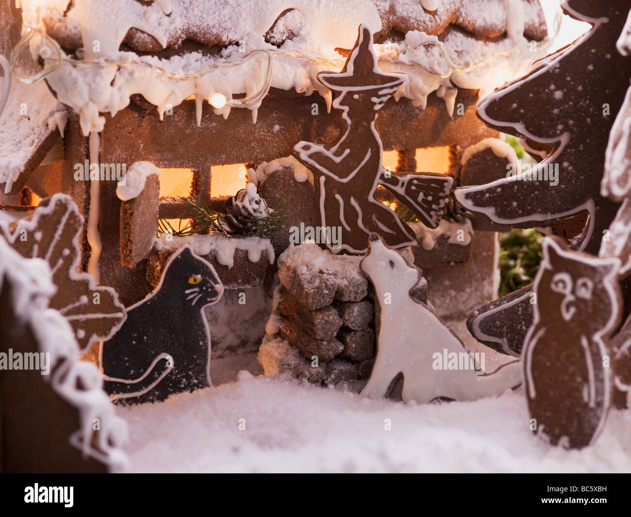 Gingerbread house with gingerbread animals and witch Stock Photo - Alamy