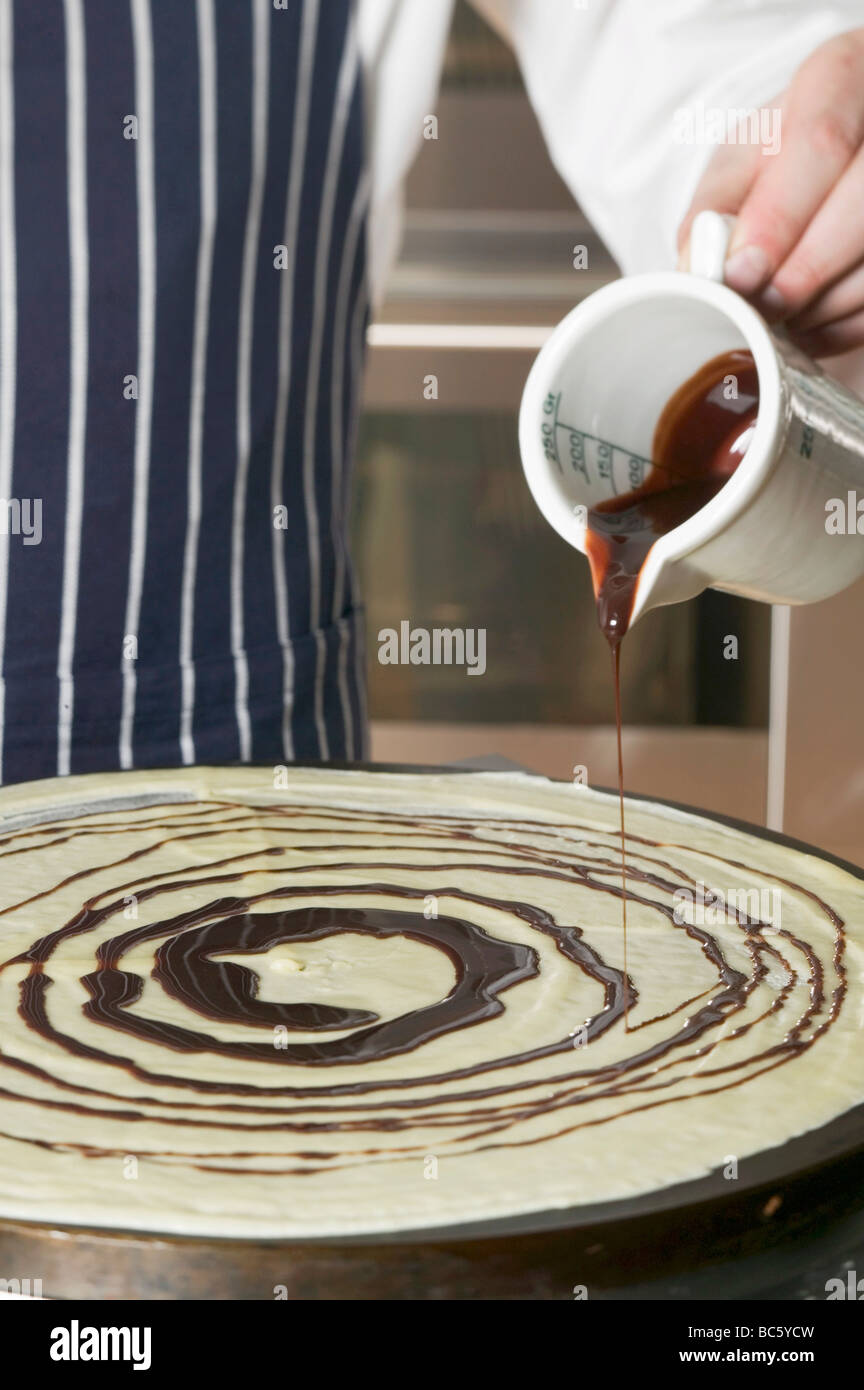 Person pouring sauce onto hi-res stock photography and images - Alamy