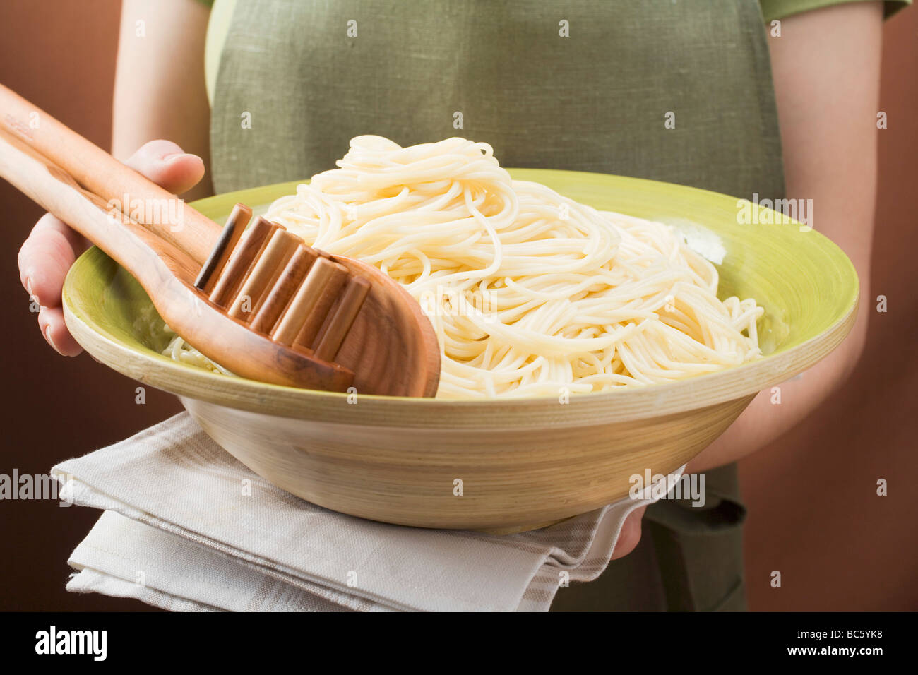 Person hand serving spaghetti pasta hi-res stock photography and images ...