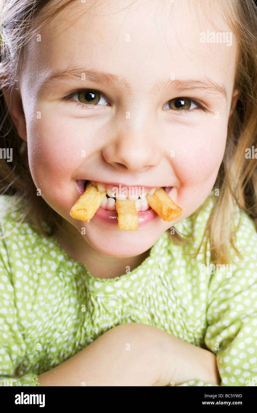 Girl eating chips Stock Photo - Alamy