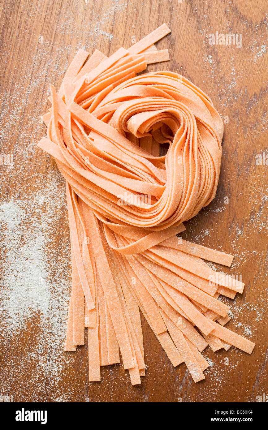 Home-made orange ribbon pasta Stock Photo - Alamy