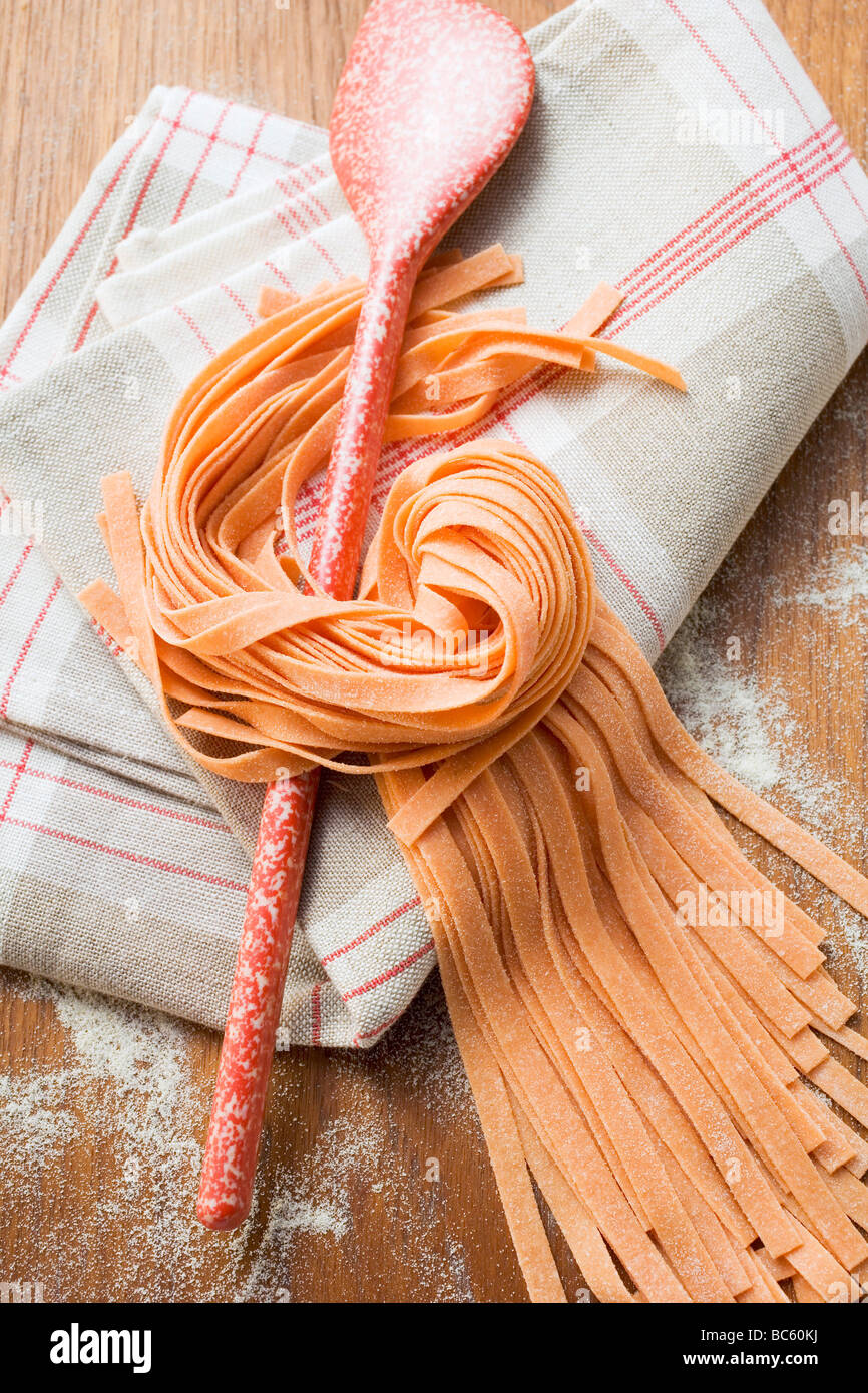 Home-made orange ribbon pasta Stock Photo - Alamy