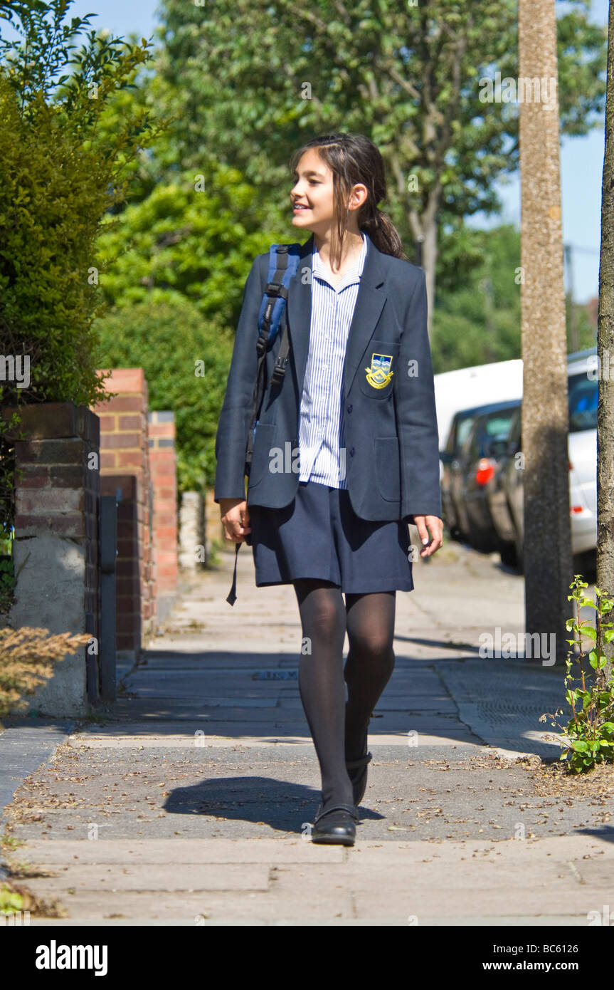 Uniform school children walking home hi-res stock photography and ...