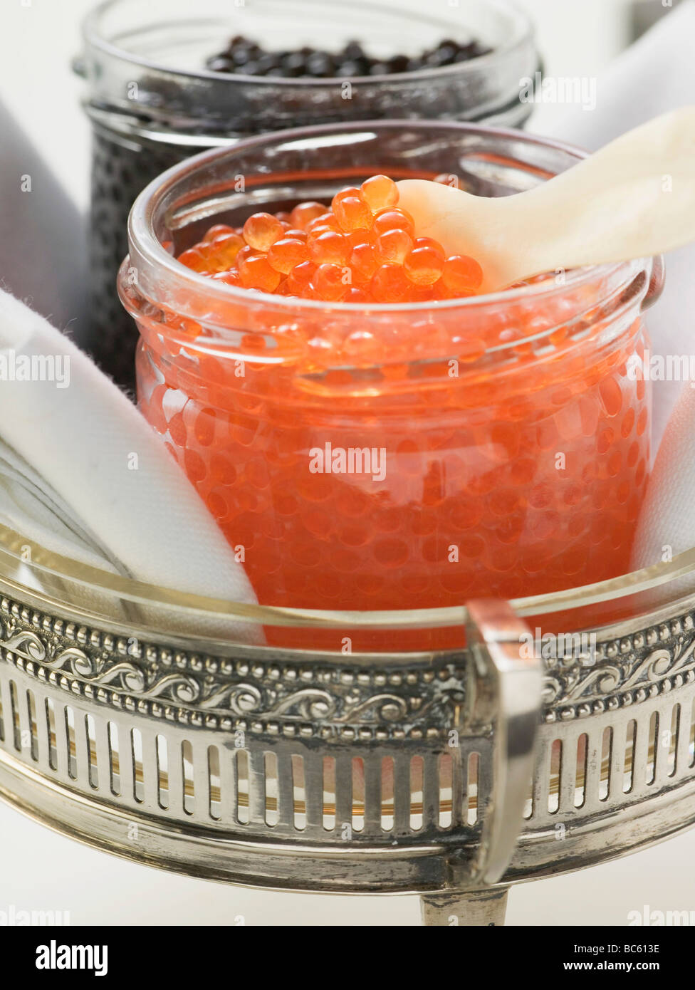 Black caviar and Keta caviar in jars Stock Photo - Alamy