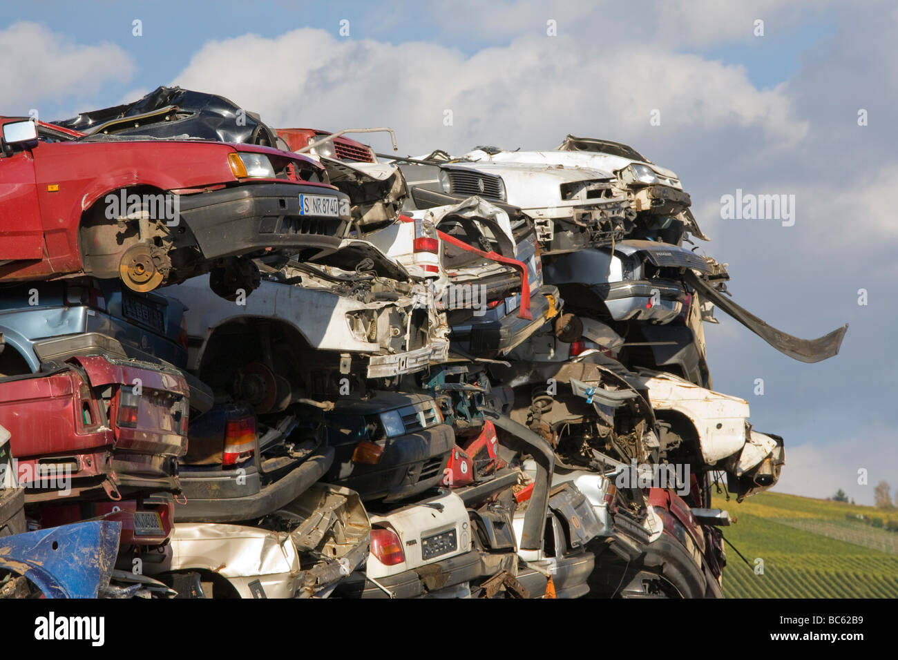 Scrapyard, Stack of crushed cars Stock Photo - Alamy