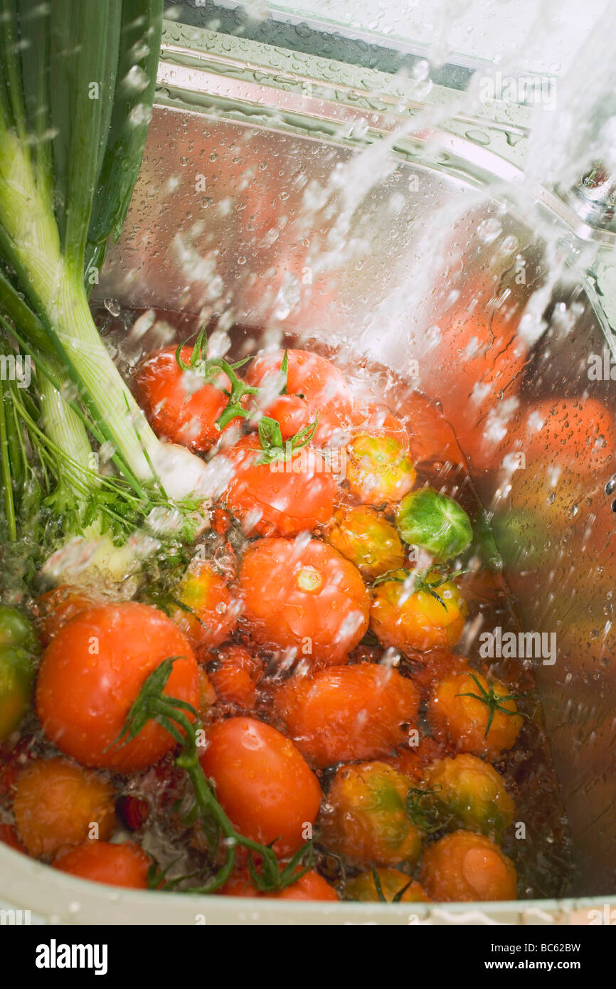 Washing tomatoes and spring onions Stock Photo - Alamy