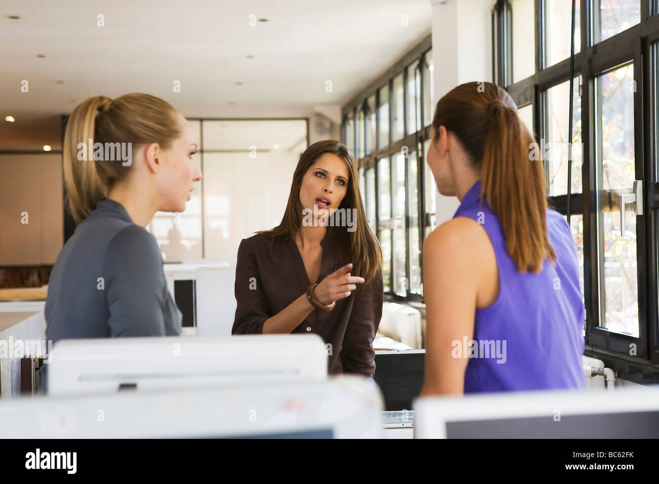 Three women in office having an argument Stock Photo - Alamy