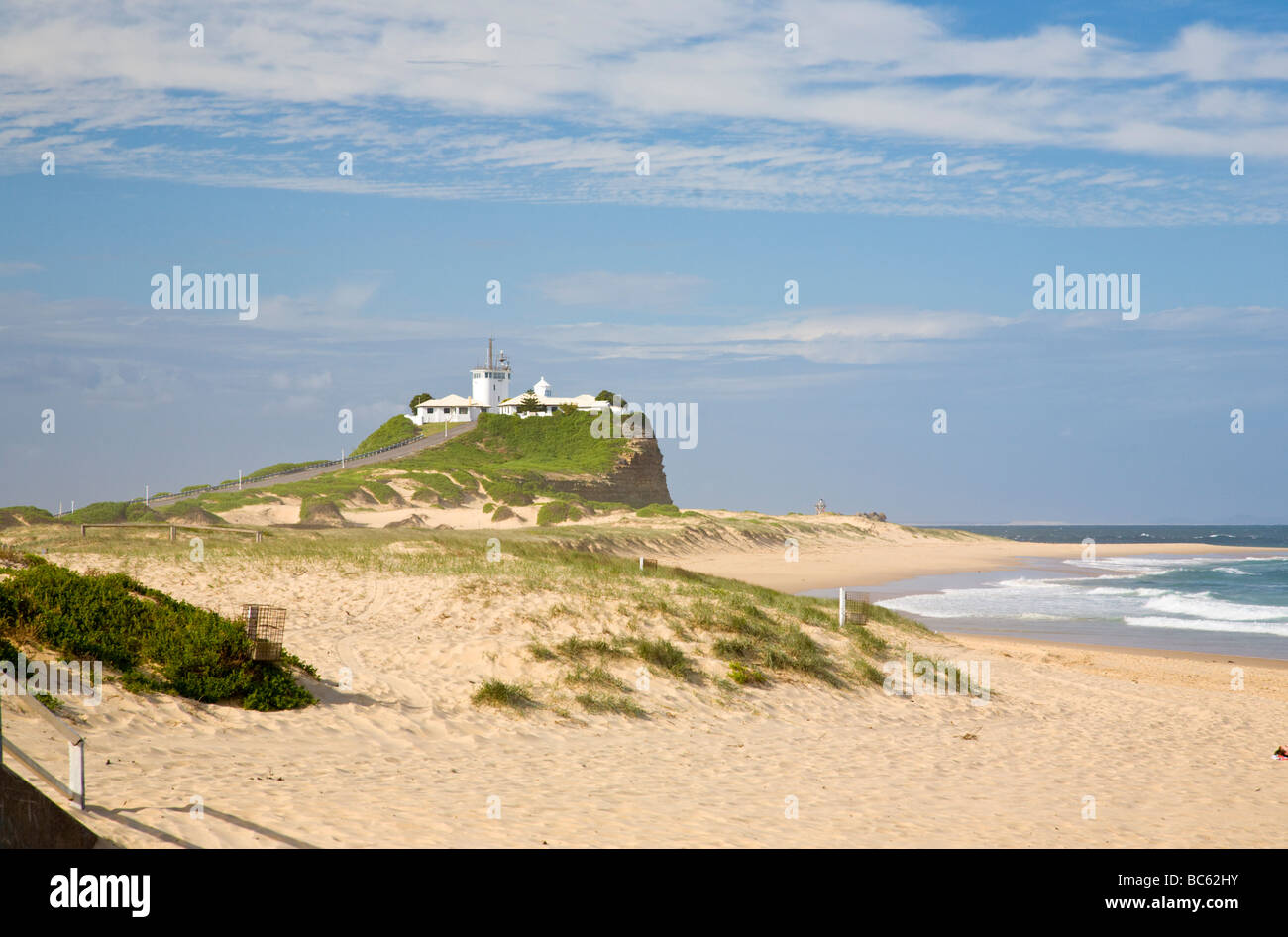 Nobbys Beach with Nobbys Head Lighthouse in the distance Newcastle NSW ...