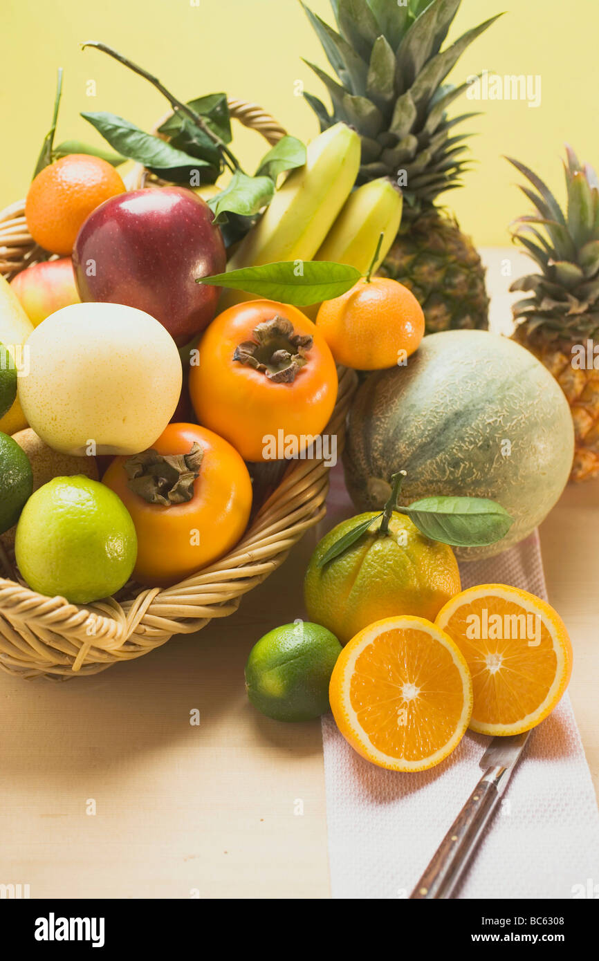 An assortment of fresh fruit, partly in basket Stock Photo - Alamy
