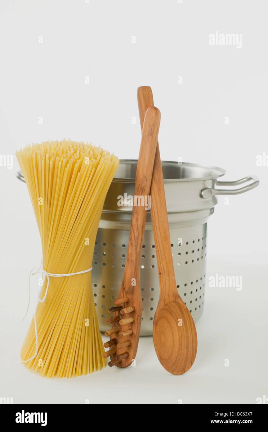 Spaghetti, spaghetti pan, spaghetti server & wooden spoon Stock Photo ...