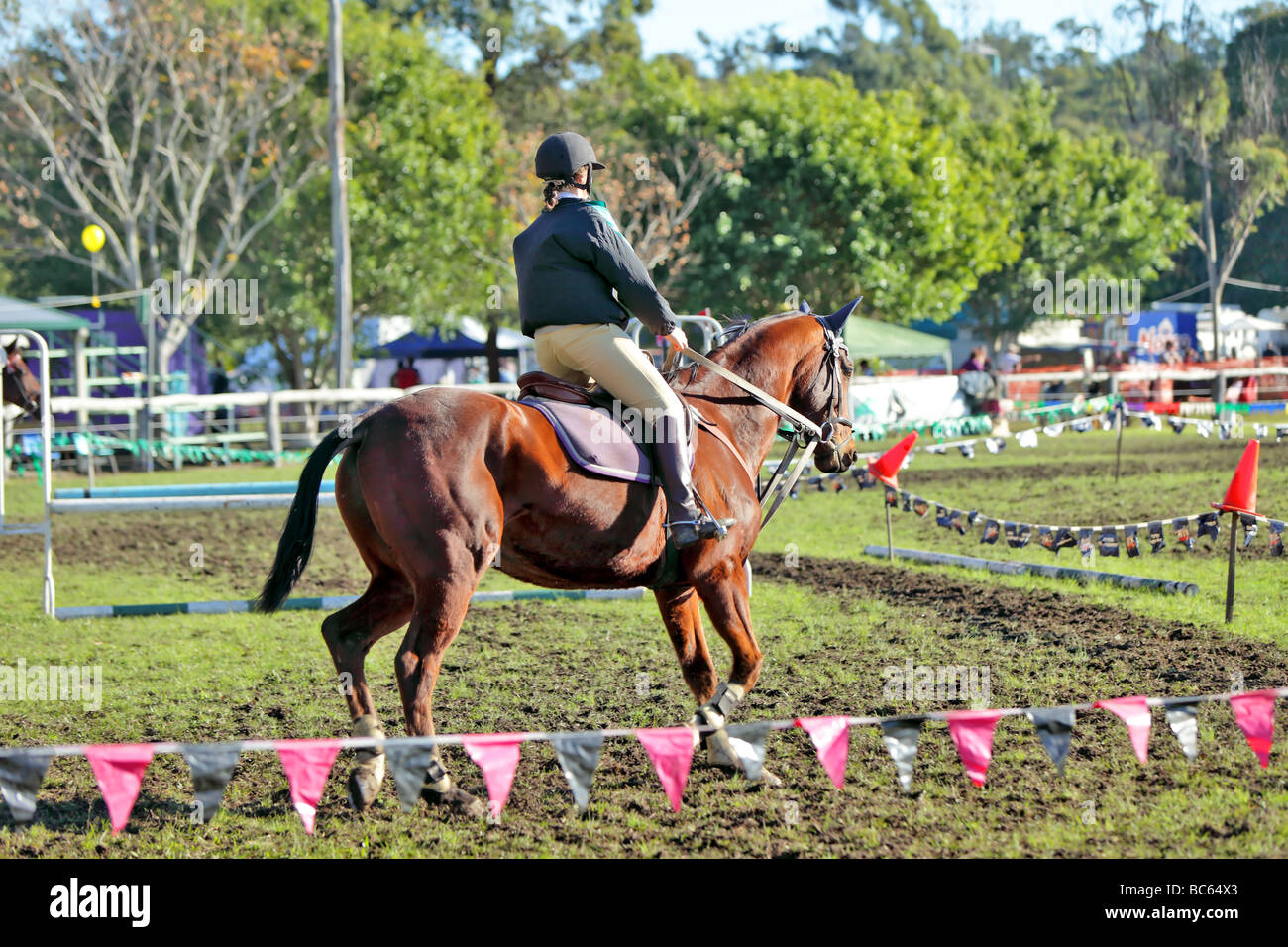 Horse jumping competition at local show with women riders Stock Photo ...