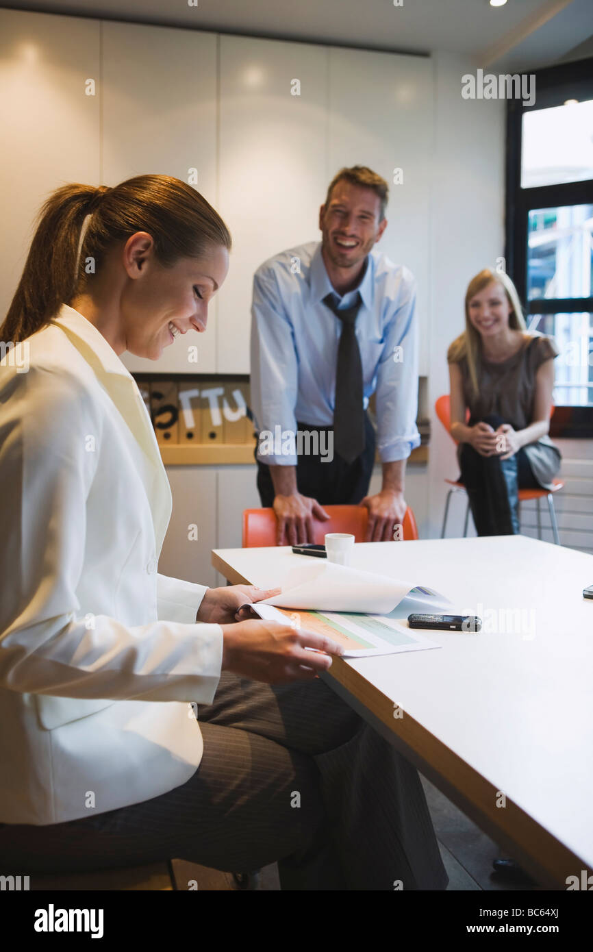 Business people in office, woman looking at documents Stock Photo - Alamy