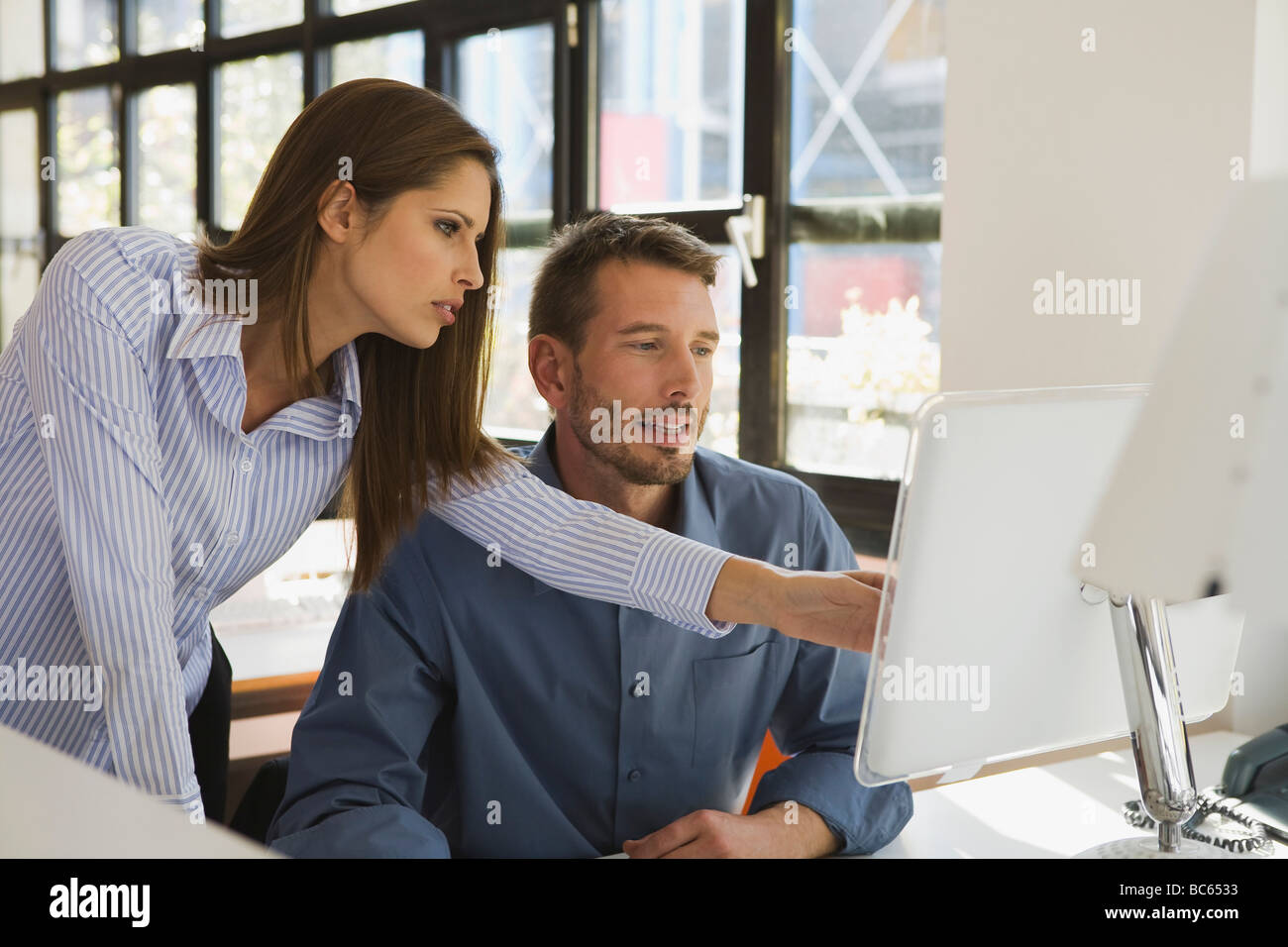Business people in office using computer Stock Photo - Alamy