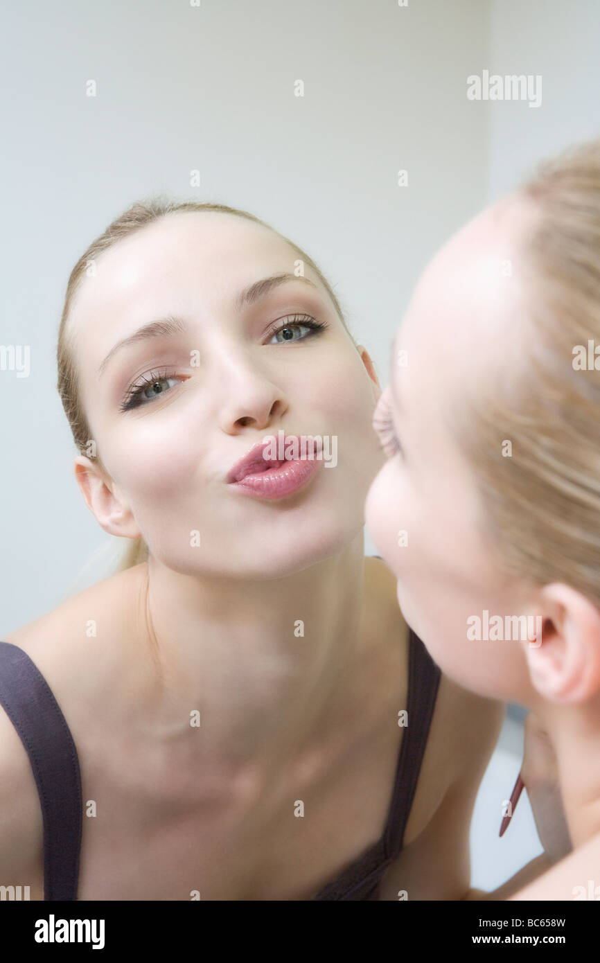 Young woman puckering lips, portrait Stock Photo - Alamy