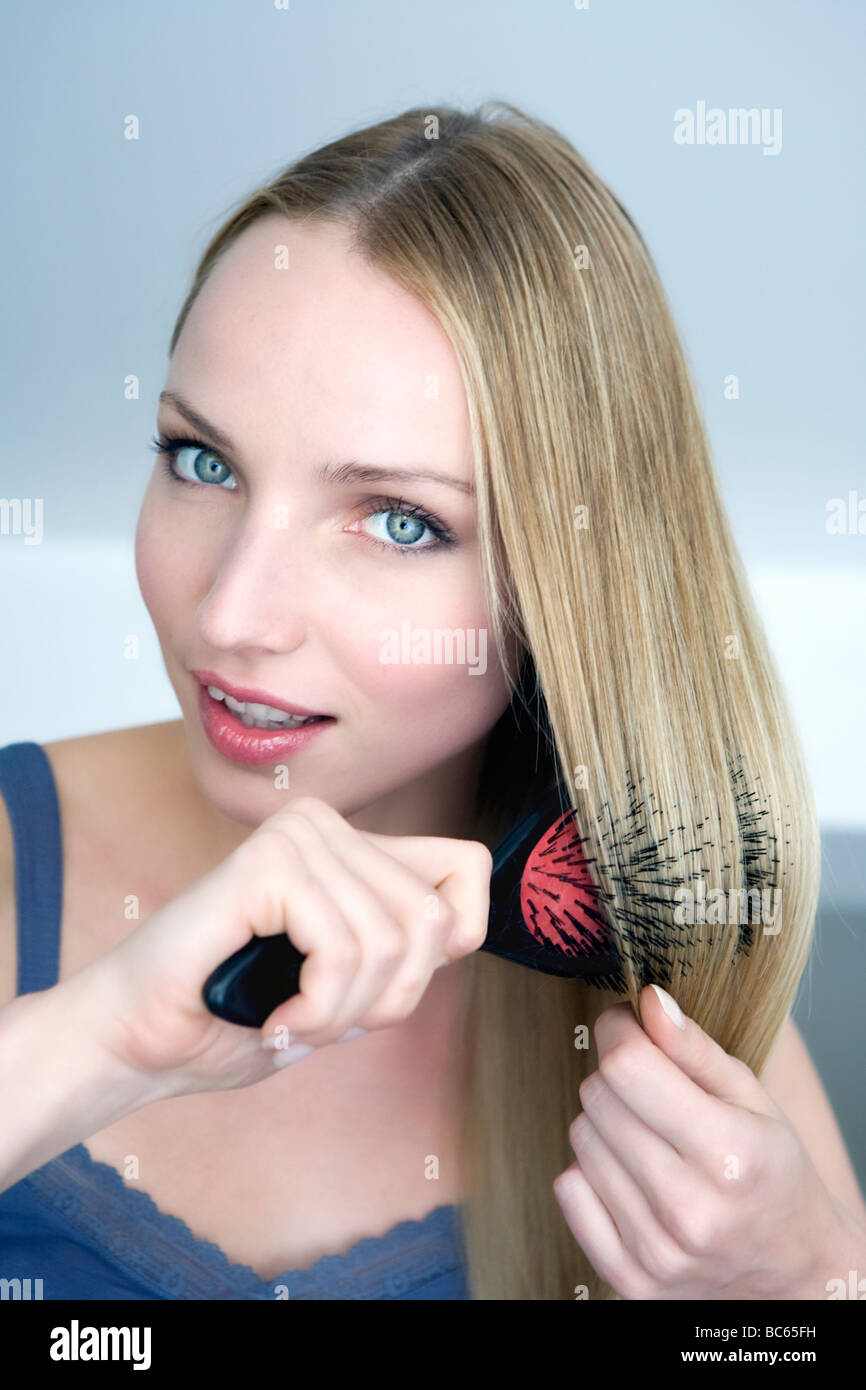 Brushing hairs woman hi-res stock photography and images - Alamy