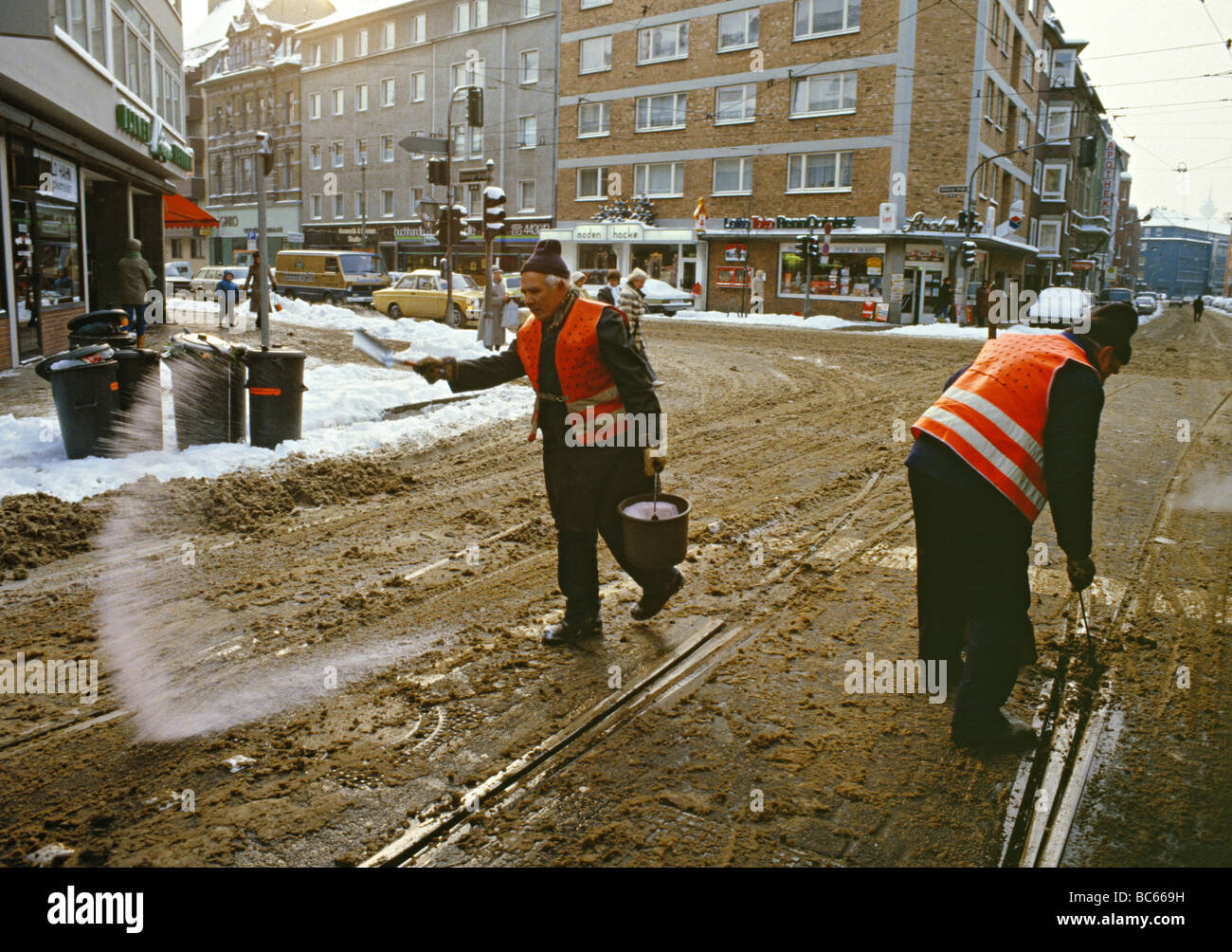 Workmen clearing snow and ice from tram tracks in Düsseldorf, Germany ...