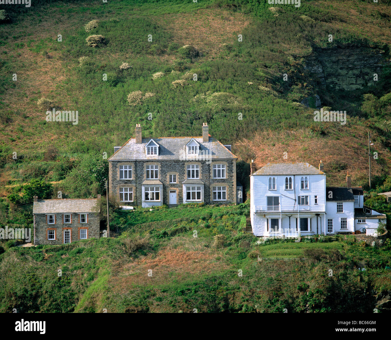 These stately homes overlook the small harbor at Port Isaac in Cornwall ...