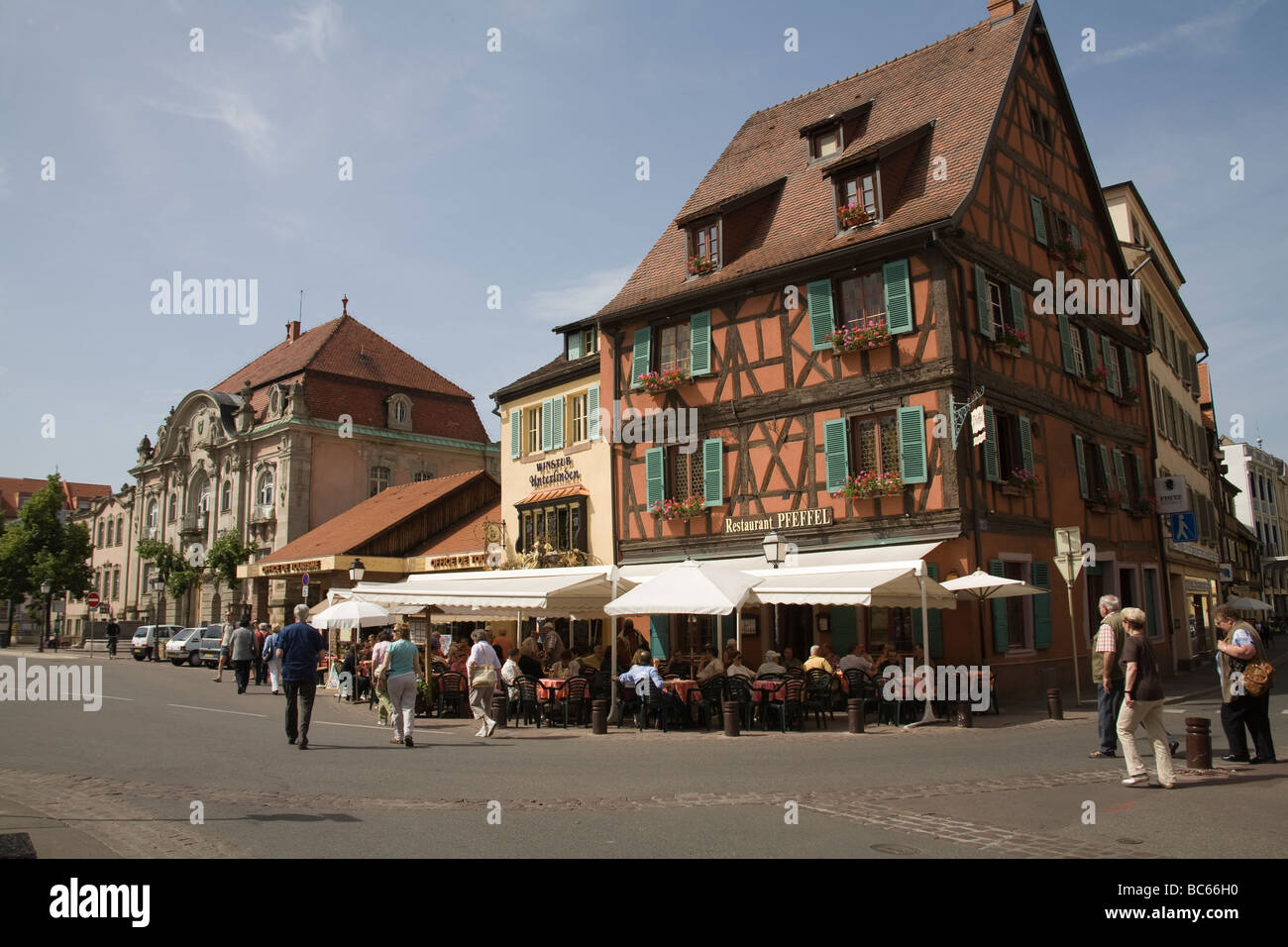 Colmar Alsace France EU People dining outside in spring sunshine at a ...