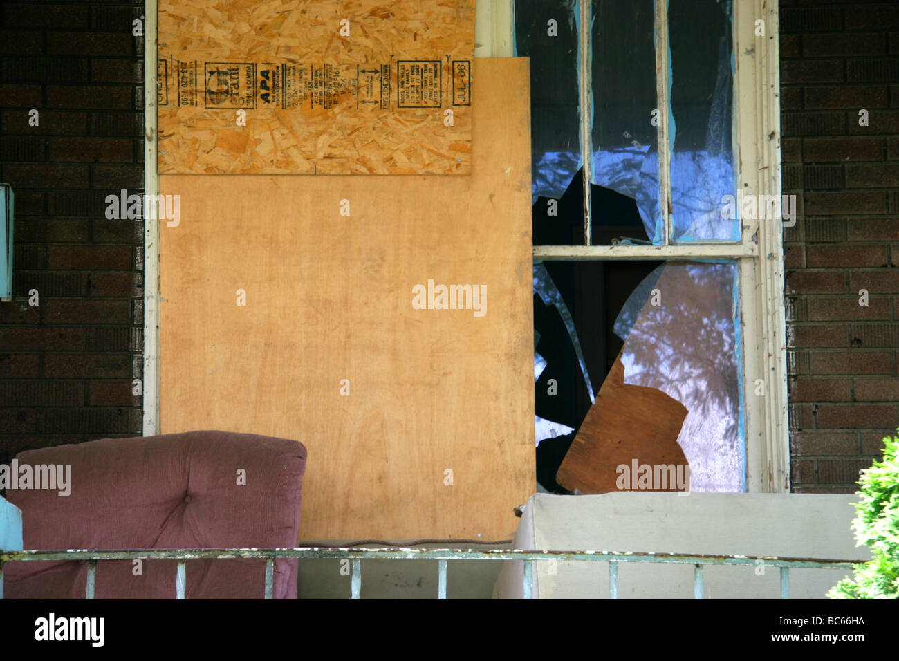 Smashed and boarded up house window in Detroit Michigan USA Stock Photo ...