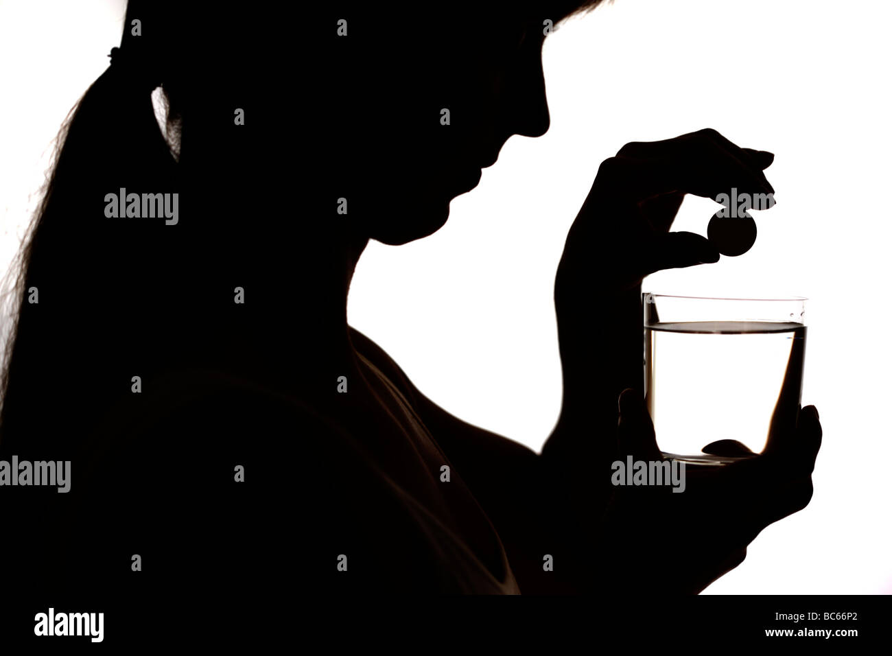 Woman is solving a fizzy tablet in water Pill capsule medicament Stock ...
