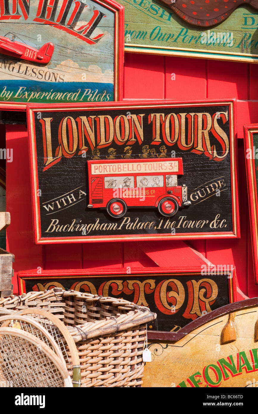 London Tours - Sign with red double decker bus at Alice's shop in ...