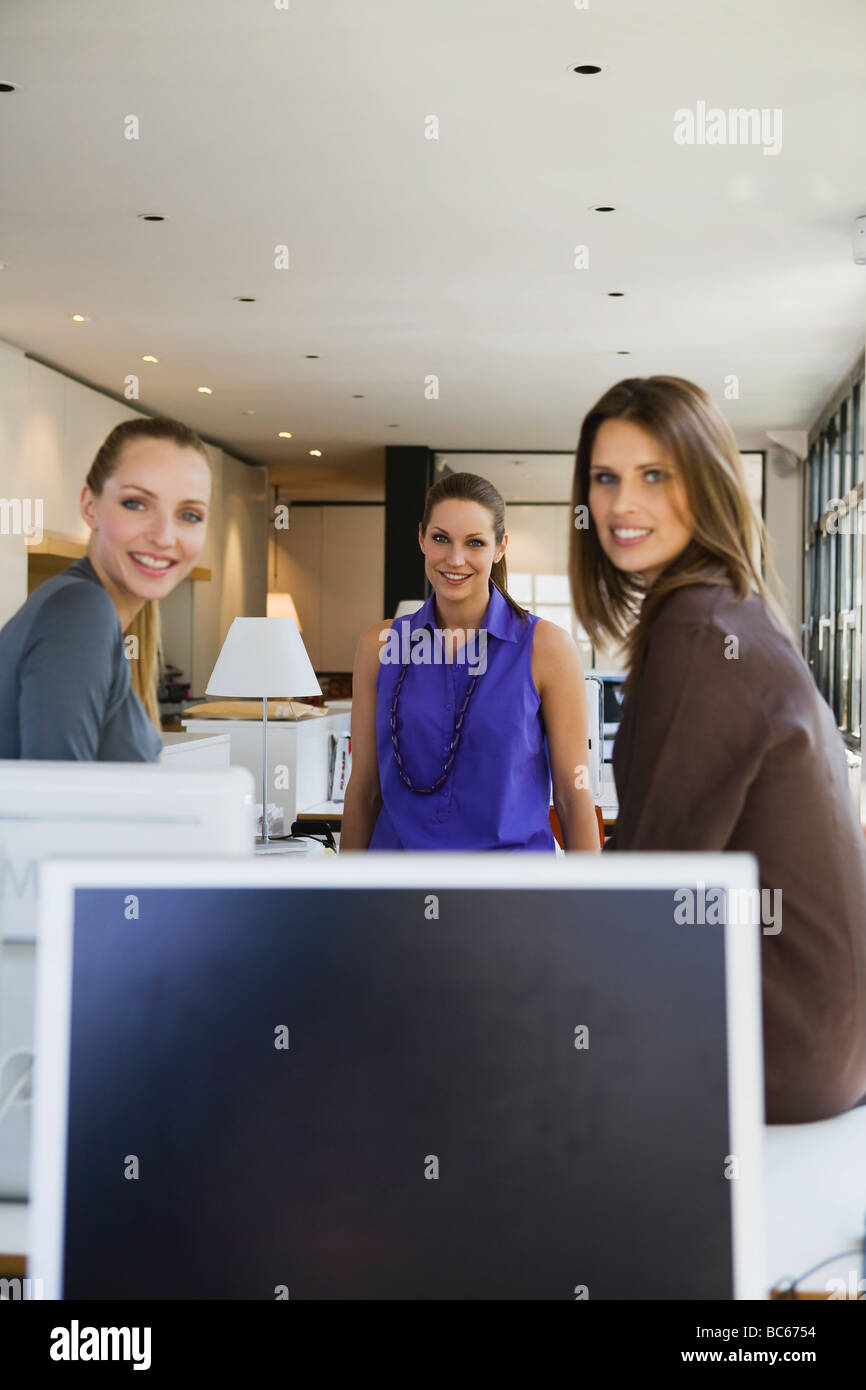 Three women in office Stock Photo - Alamy