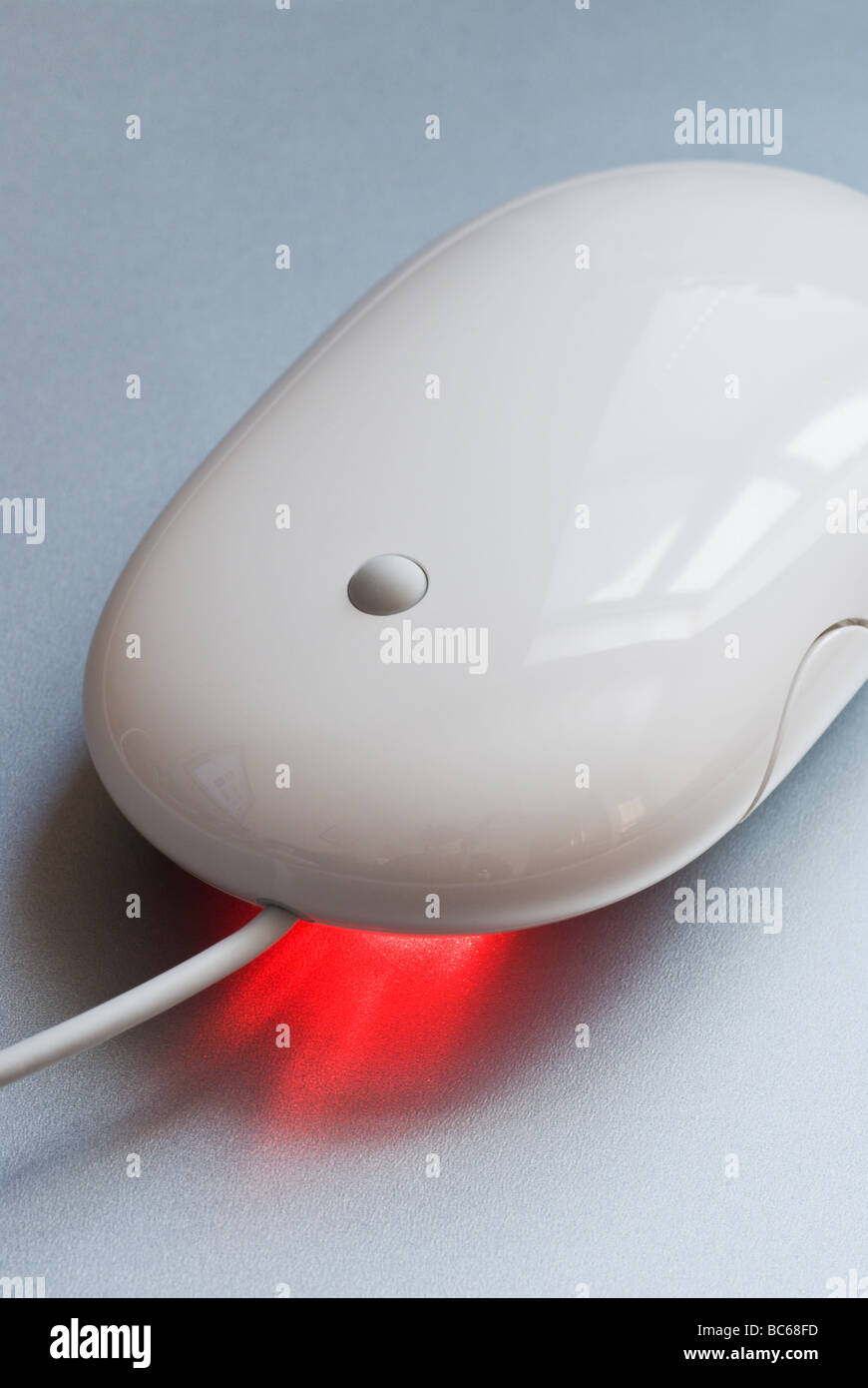 A working computer mouse on a silver background Stock Photo - Alamy