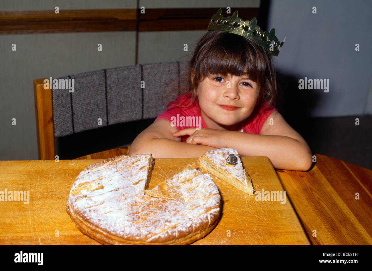 Girl with La Galette des Rois (French King Cake) with Feve and Crown ...