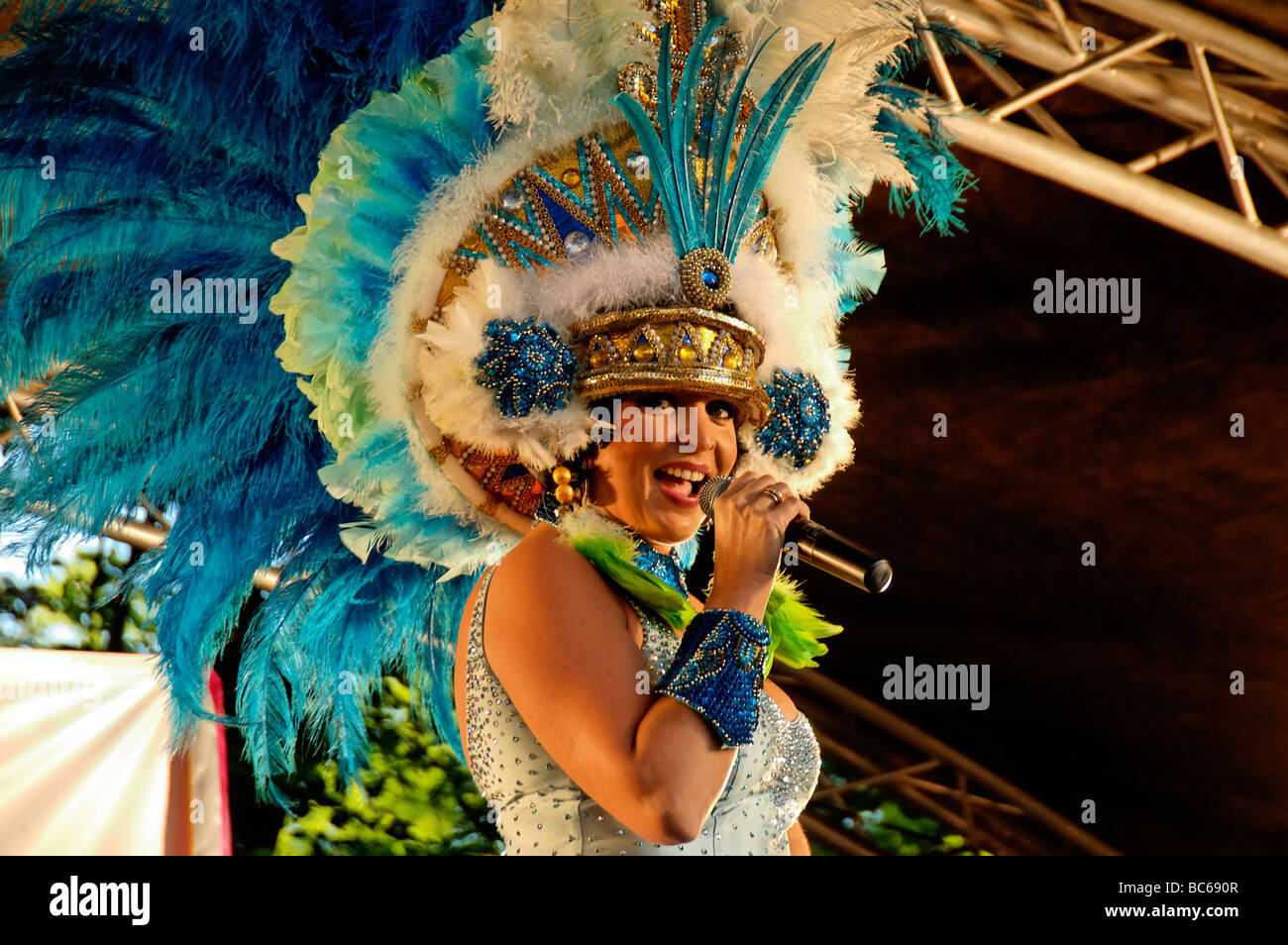 Beautiful singer in carnival dress Stock Photo - Alamy