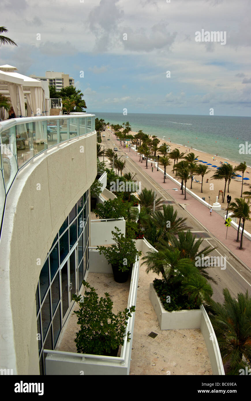 Balcony terraces at hotel overlooking beach and walkway boulevard Stock ...