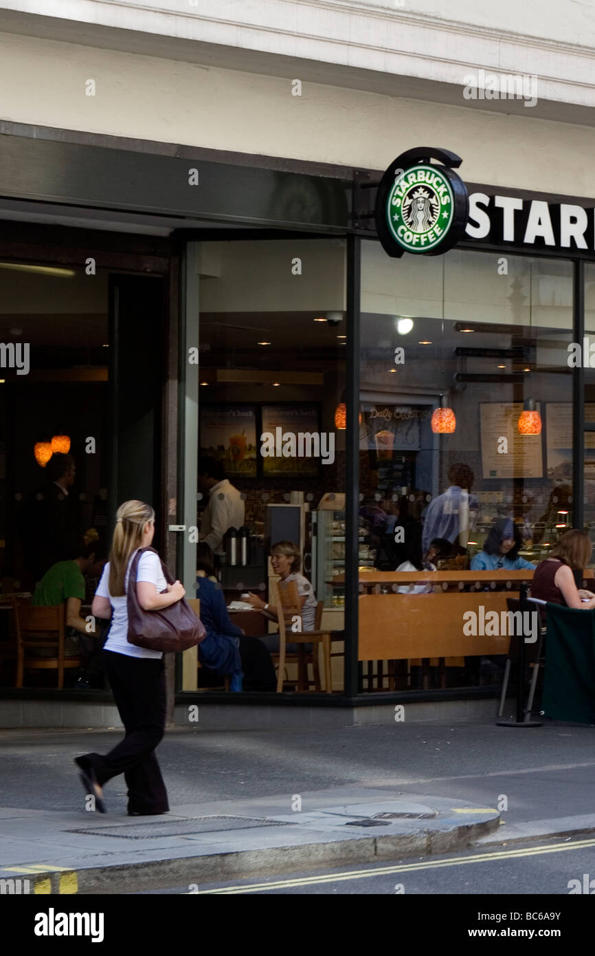 Girl Walking past Starbucks Stock Photo - Alamy