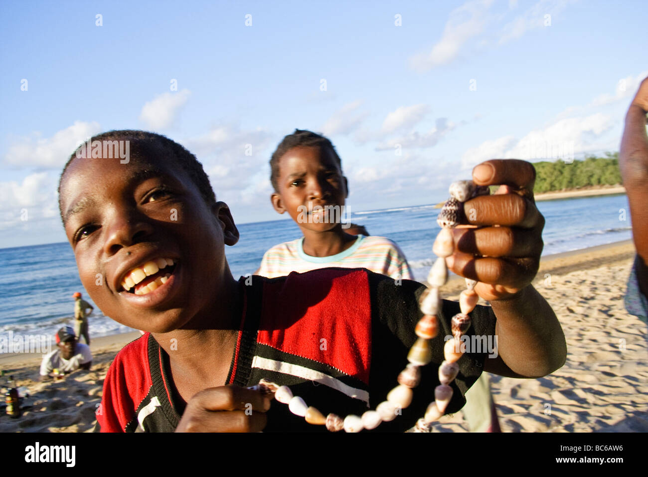 Local kids selling souvenirs on the beach at Tofu, Mozambique Stock ...