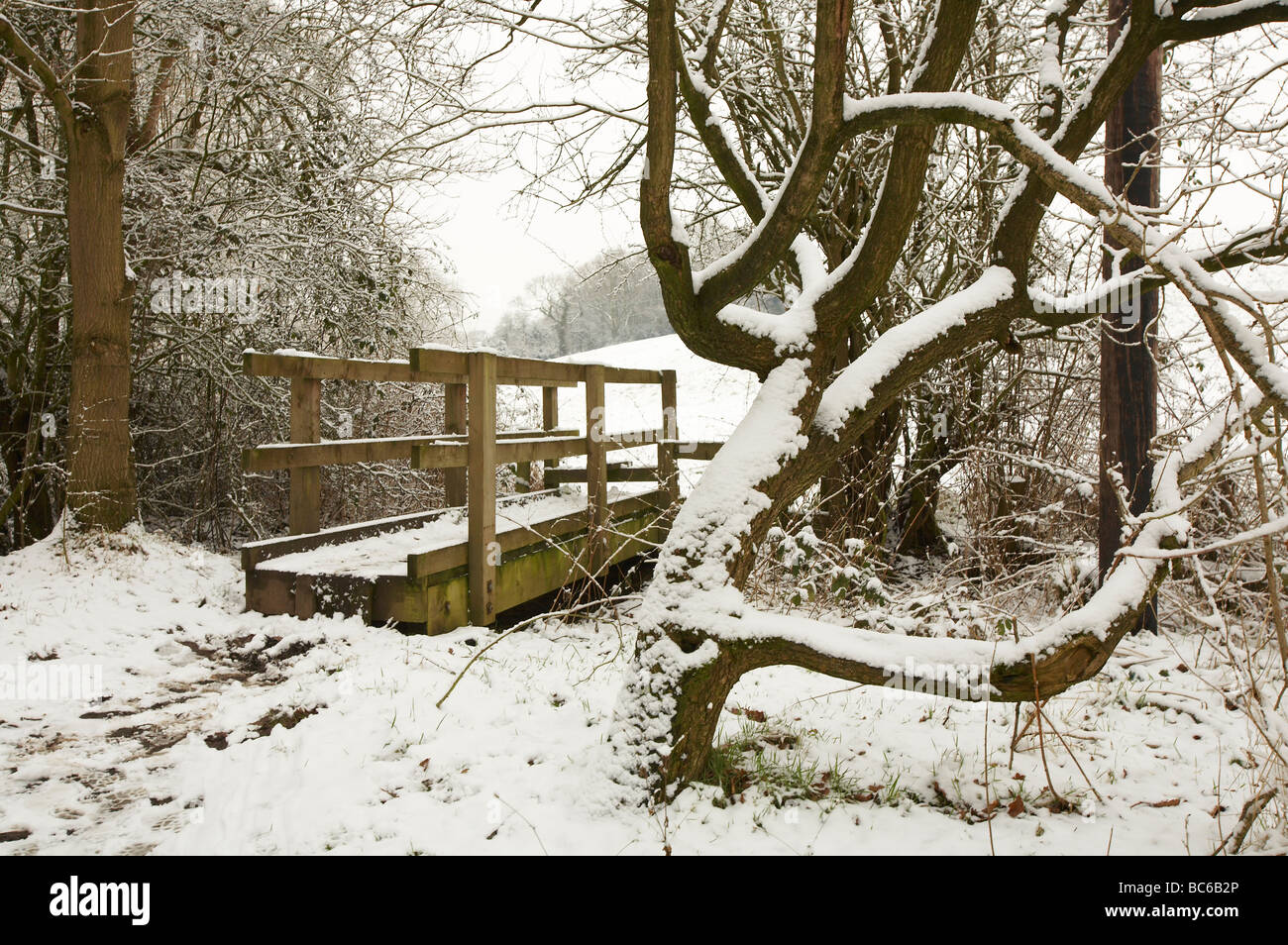 Bridge in snow Stock Photo - Alamy