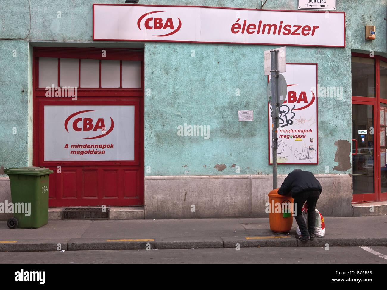 A man rummaging through trash in Budapest, capital of Hungary Stock ...