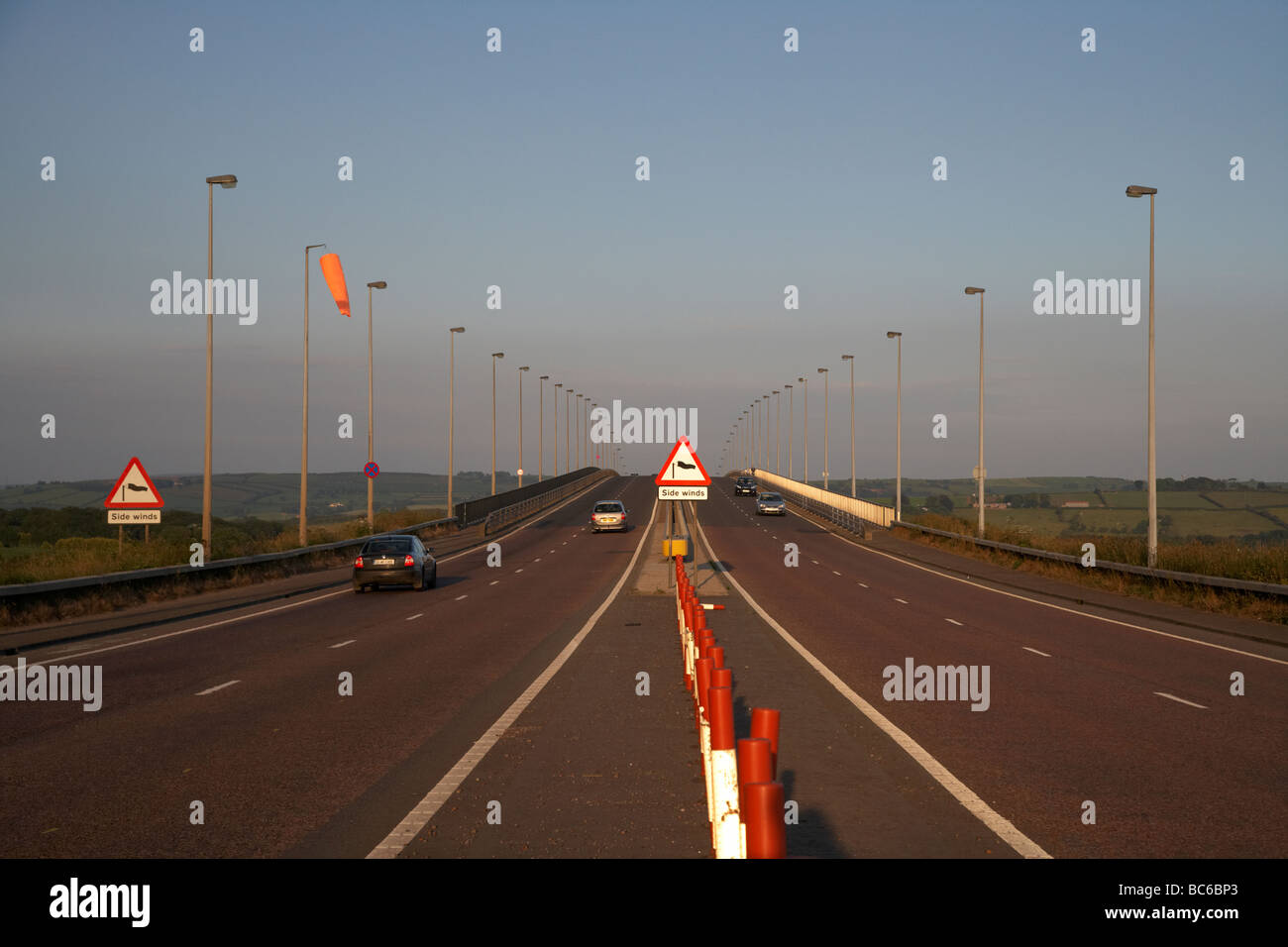 windsock and warning signs about high winds on the foyle bridge over ...