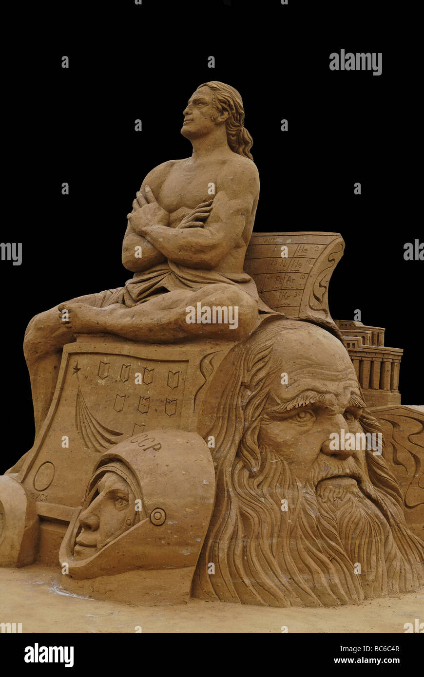 Sand sculpture of sitting man Stock Photo - Alamy