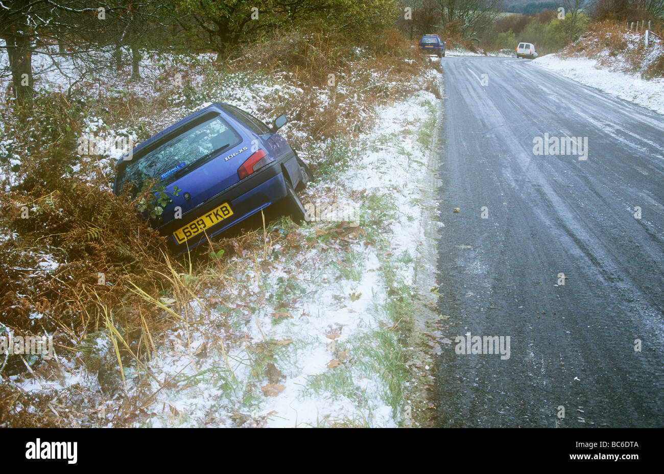 A car skidded and crashed on an ice road in Eskdale Cumbria UK Stock ...
