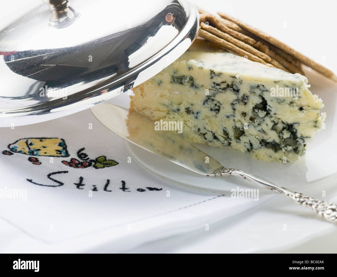 Wedge of Stilton with crackers and cheese knife Stock Photo - Alamy