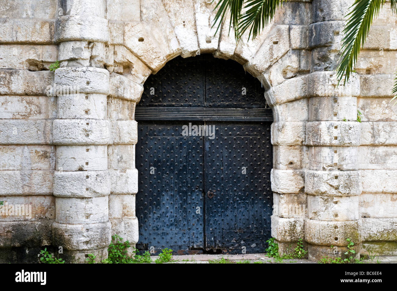 Studded old fortified gates protecting an entrance into the New ...
