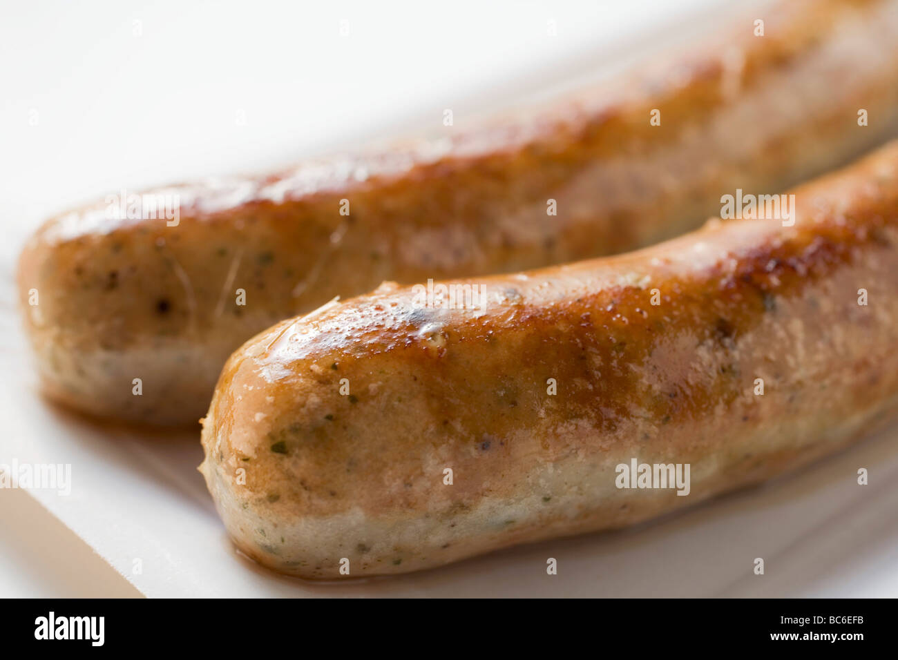 Two sausages (bratwursts) on paper plate (close-up Stock Photo - Alamy