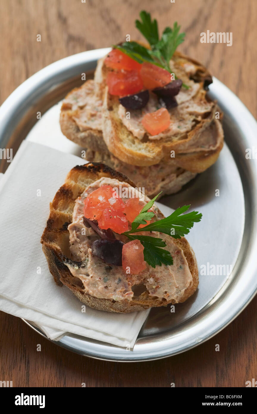Crostini with tuna spread and tomato Stock Photo - Alamy