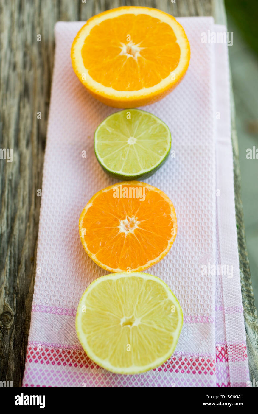 Assorted citrus fruit, halved Stock Photo - Alamy