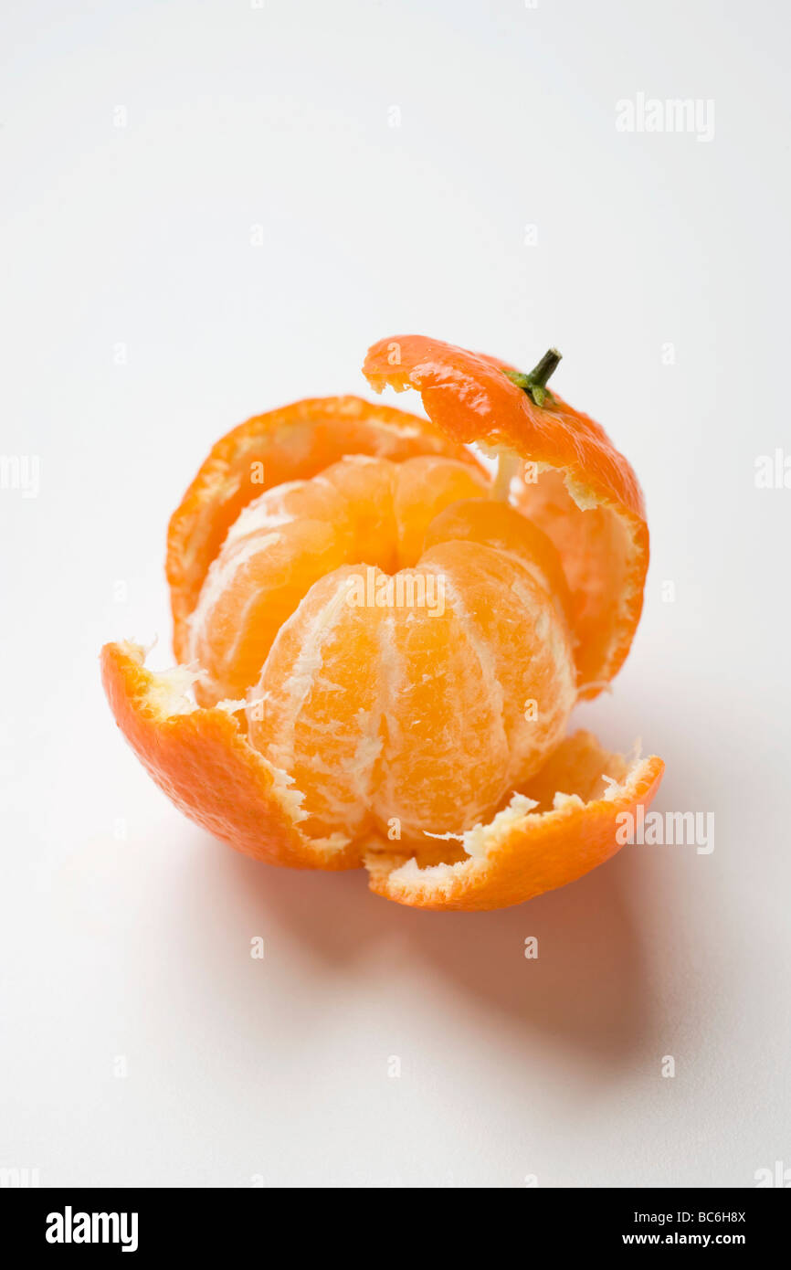 Peeled clementine Stock Photo - Alamy