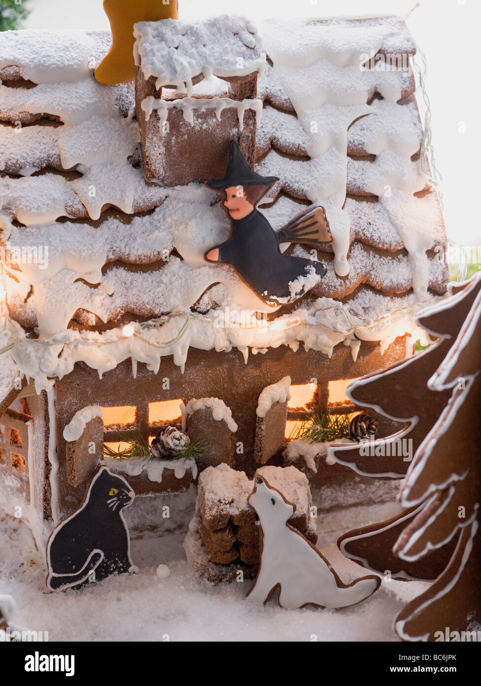 Gingerbread house with gingerbread witch and animals Stock Photo - Alamy